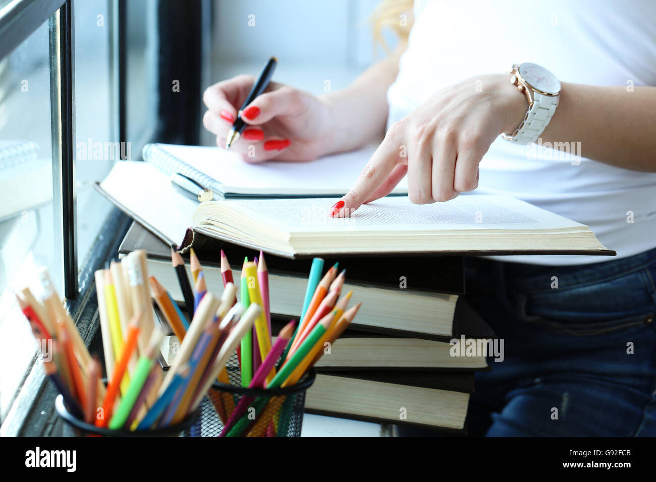 Girl with books Stock Photo - Alamy