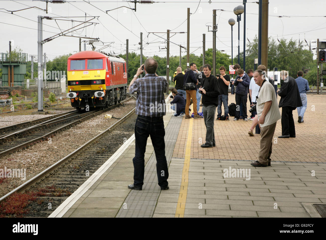 Rail enthusiasts photographing DB Schenker class 90 loco 90019 at York ...