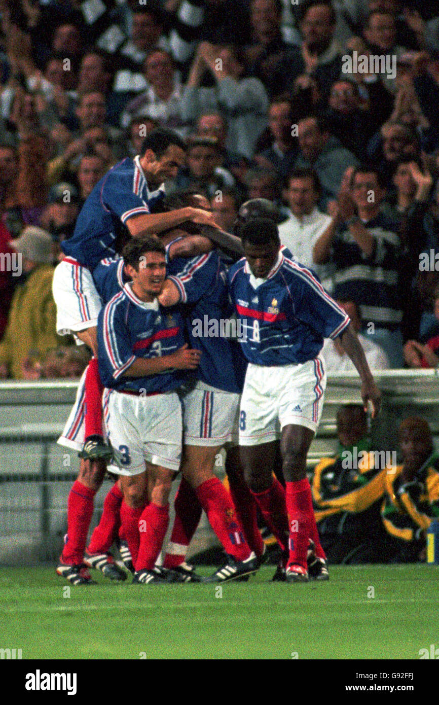 France players jump on Christophe Dugarry after he opened the scoring ...