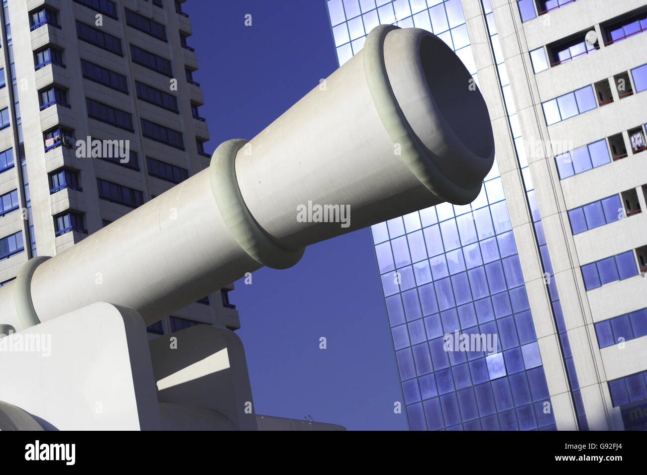 Statue of a cannon with residential blocks of flats behind, Ittihad ...