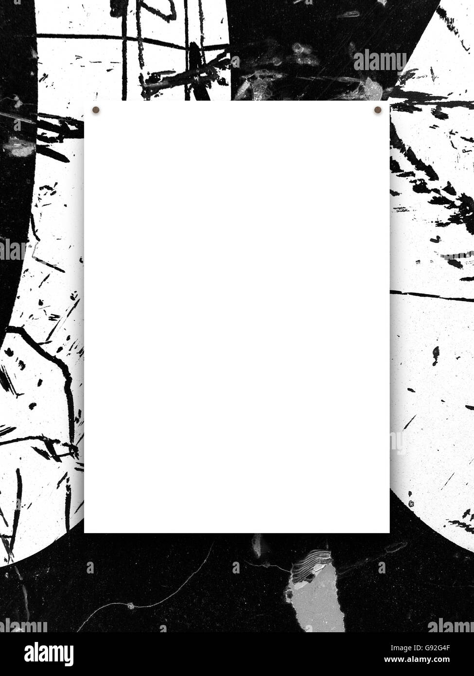 Close-up of one nailed blank frame on black and white splotchy ink ...