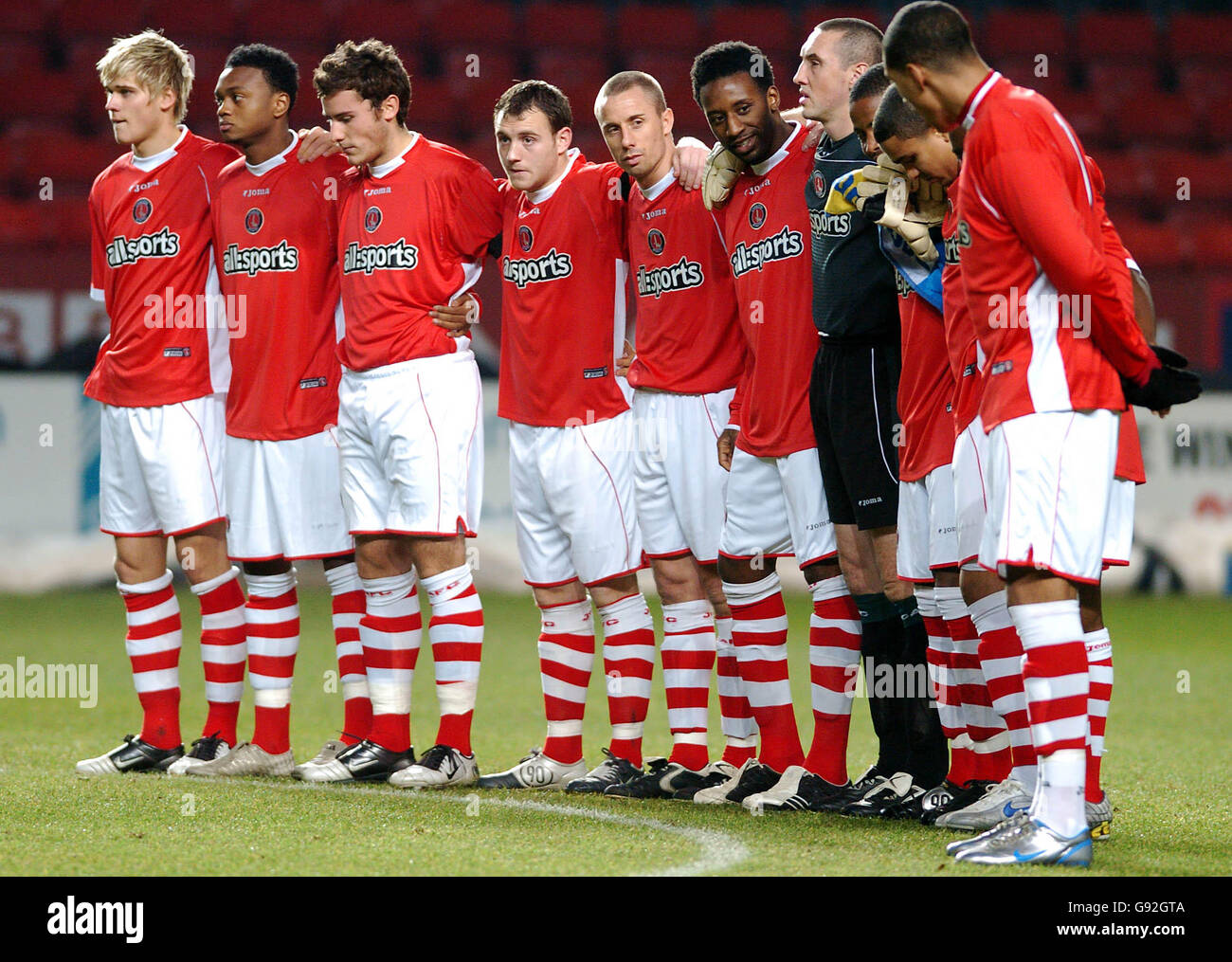 The Charlton Athletic team observe a minute of silence for former ...