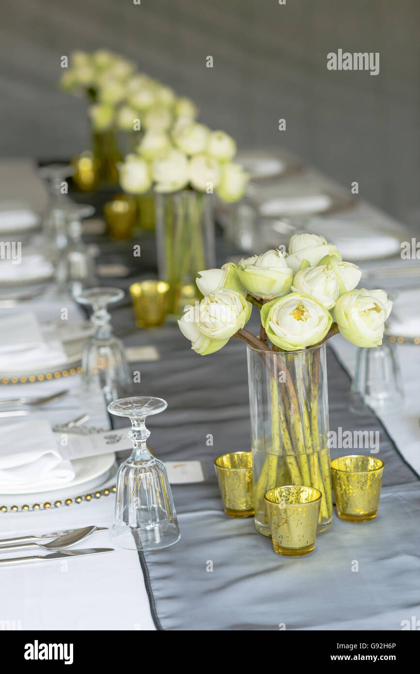 Elegance table set up with lotus flowers, selective focus Stock Photo ...