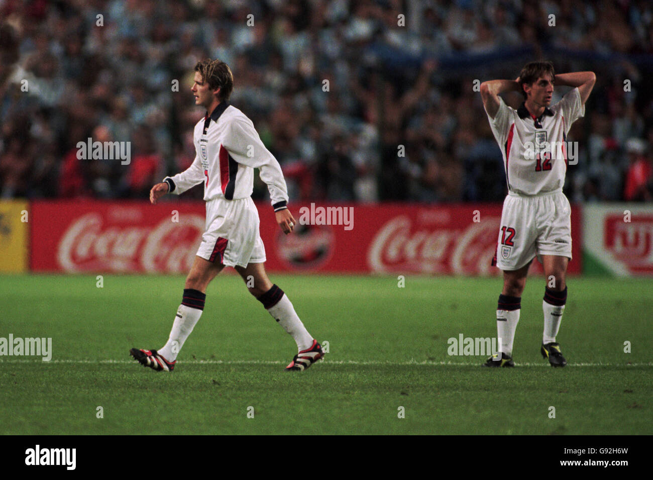 England's David Beckham (left) walks off after being sent off, as ...