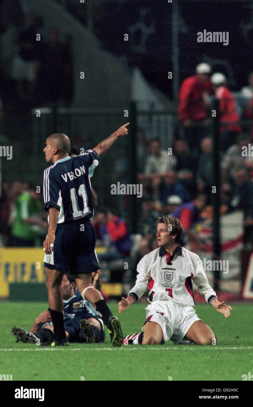 England's David Beckham (right) protests his innocence before being ...