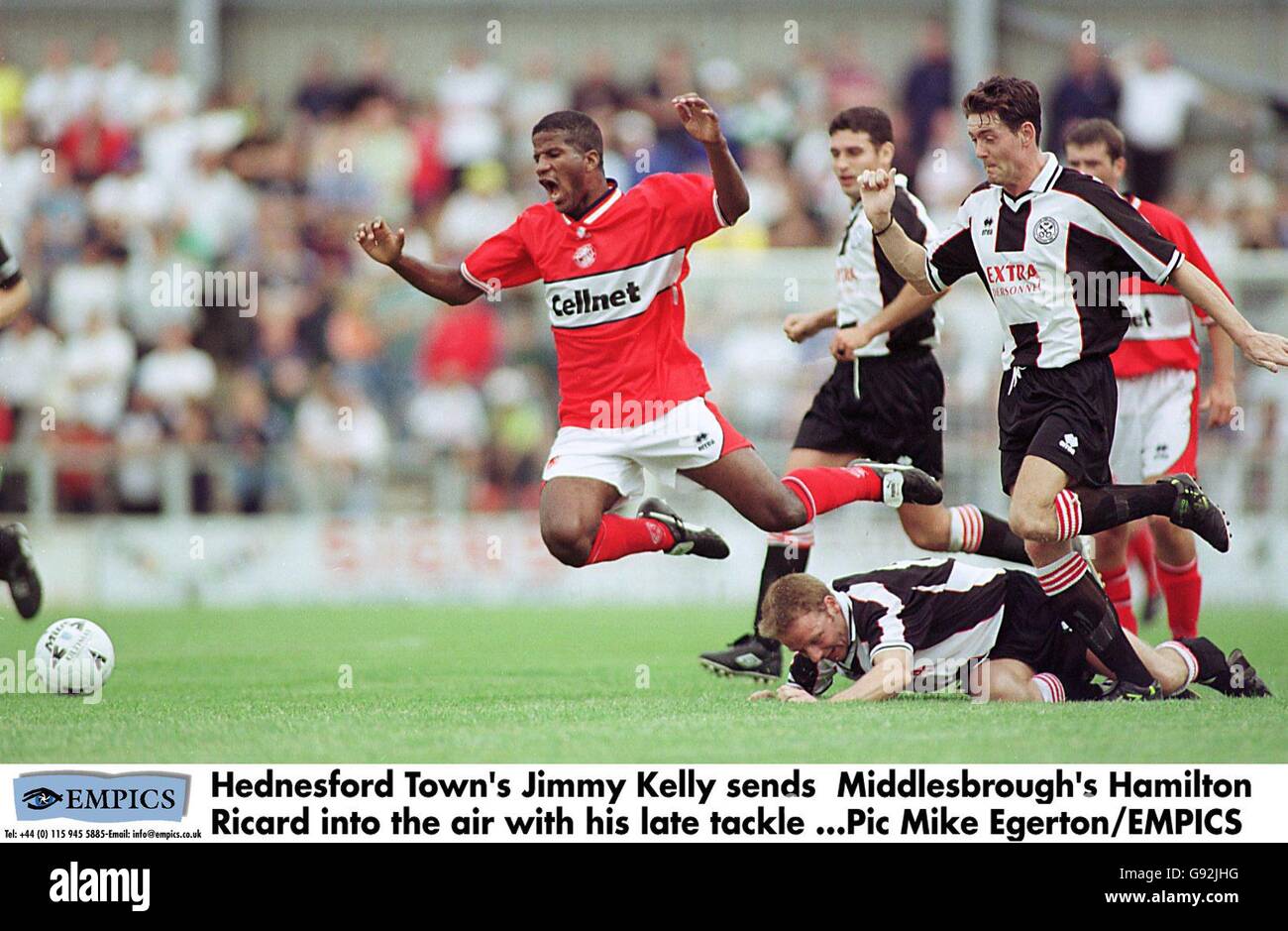 Hednesford Town's Jimmy Kelly (on floor) sends Middlesbrough's Hamilton ...