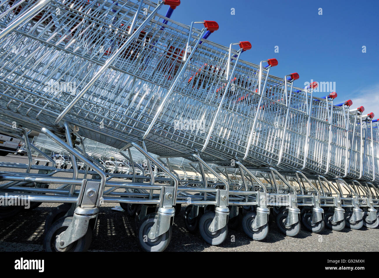 Shopping carts in a stack against a clear blue sky Stock Photo - Alamy
