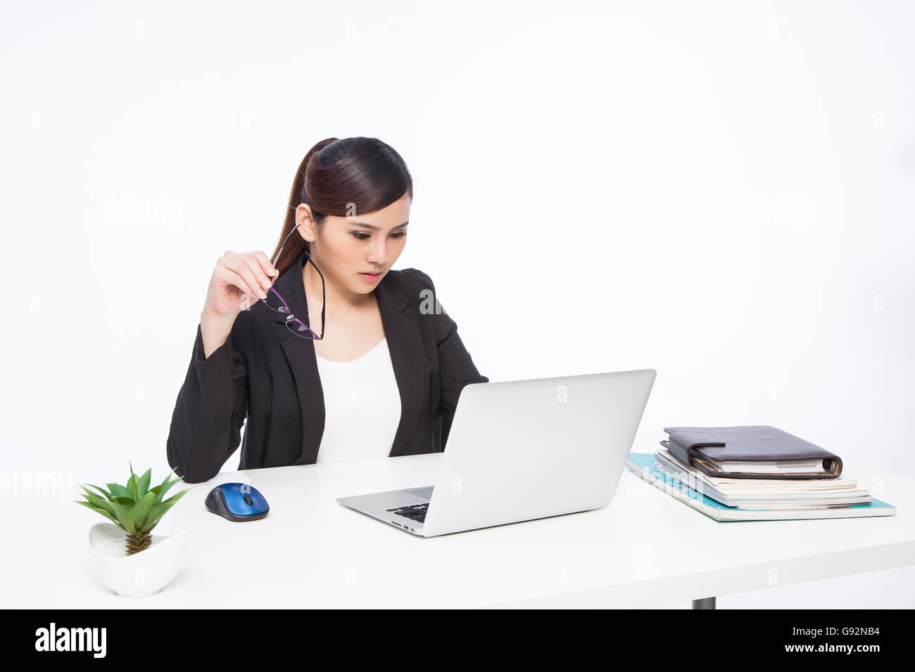 Business woman, office lady looking at computer Stock Photo - Alamy