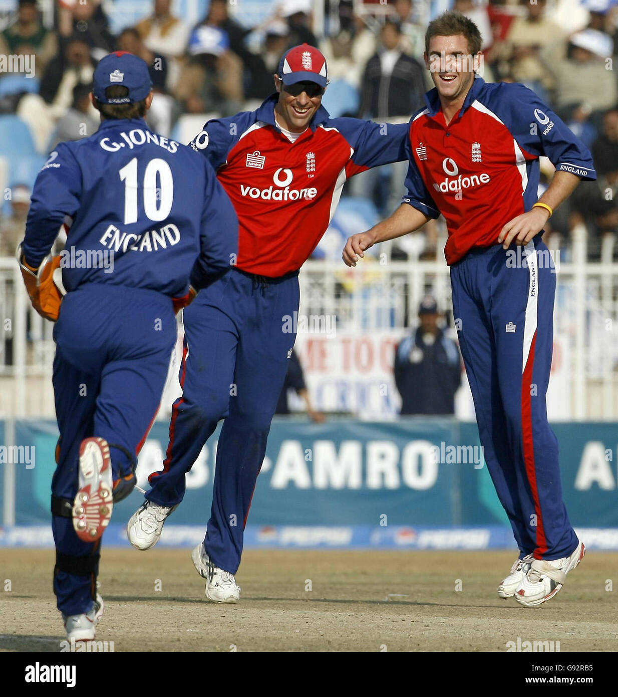 England's Liam Plunkett (R) celebrates bowling Pakistan's Adbul Razzaq ...