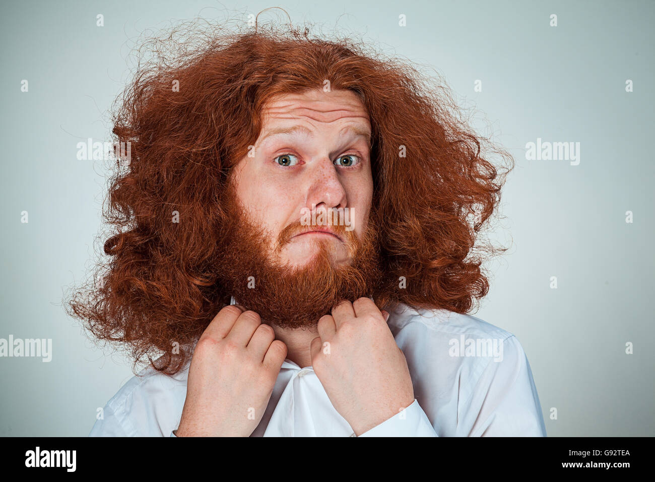 Portrait of young man with shocked facial expression Stock Photo - Alamy