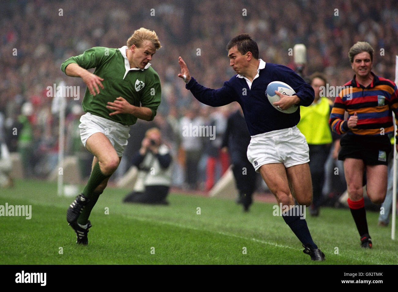 Scotland's Iwan Tukalo holds off a challenge by Ireland's Simon ...