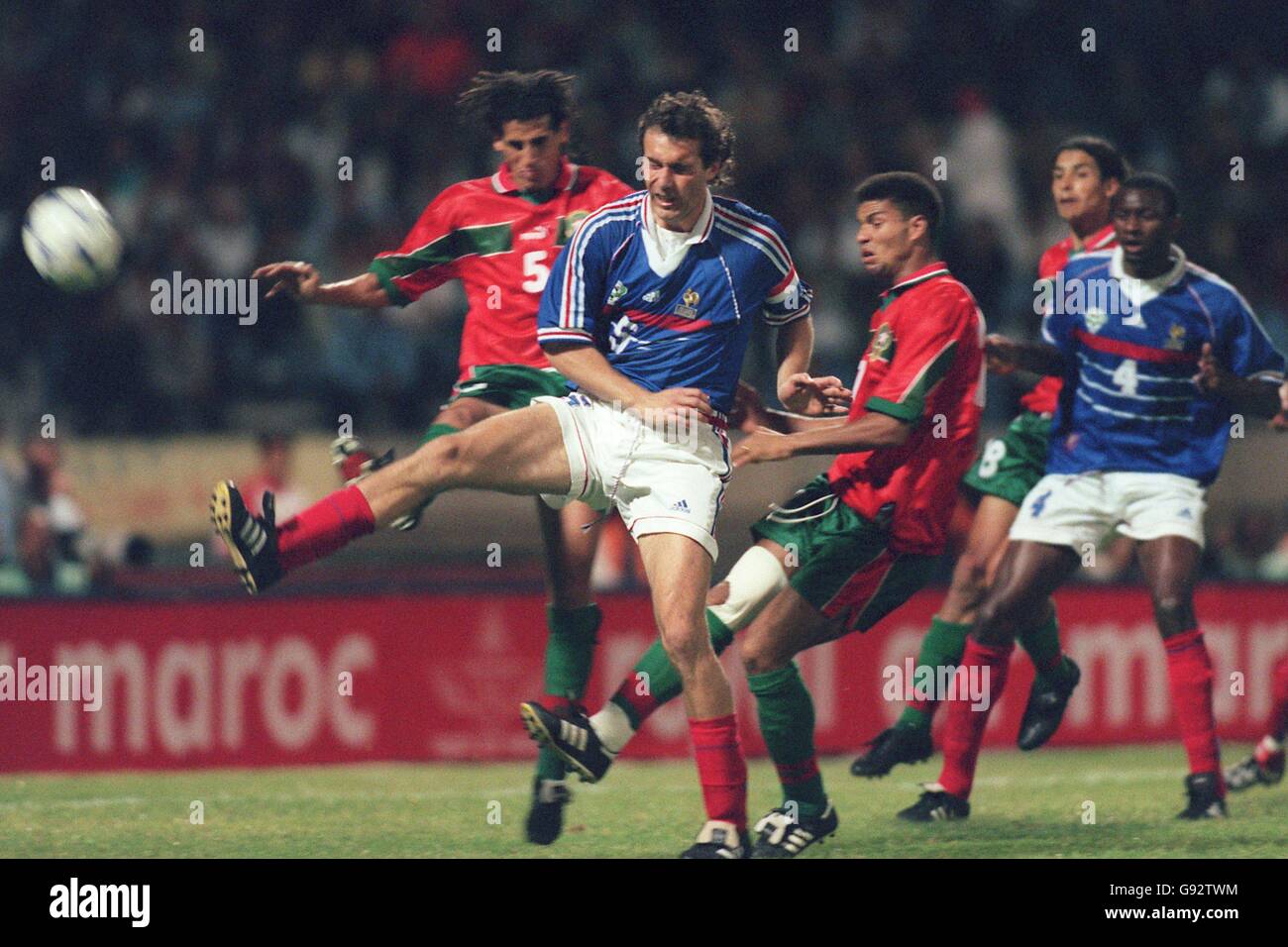 Morocco's Smahi Trikki (L), Laurent Blanc, France (C) and Gharib Amzine ...