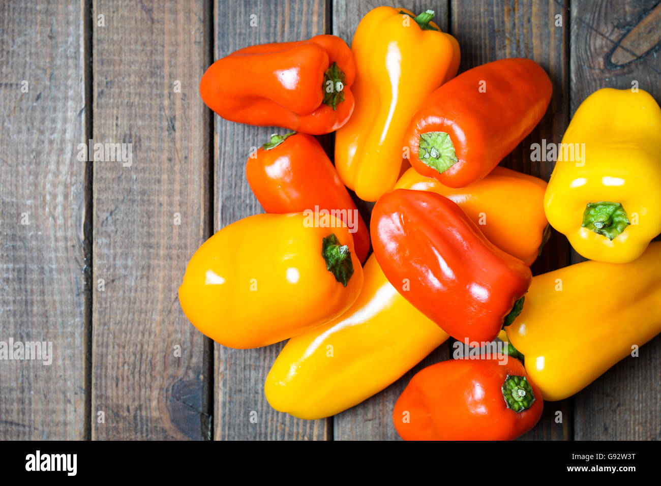 Small bell peppers in red and orange Stock Photo - Alamy