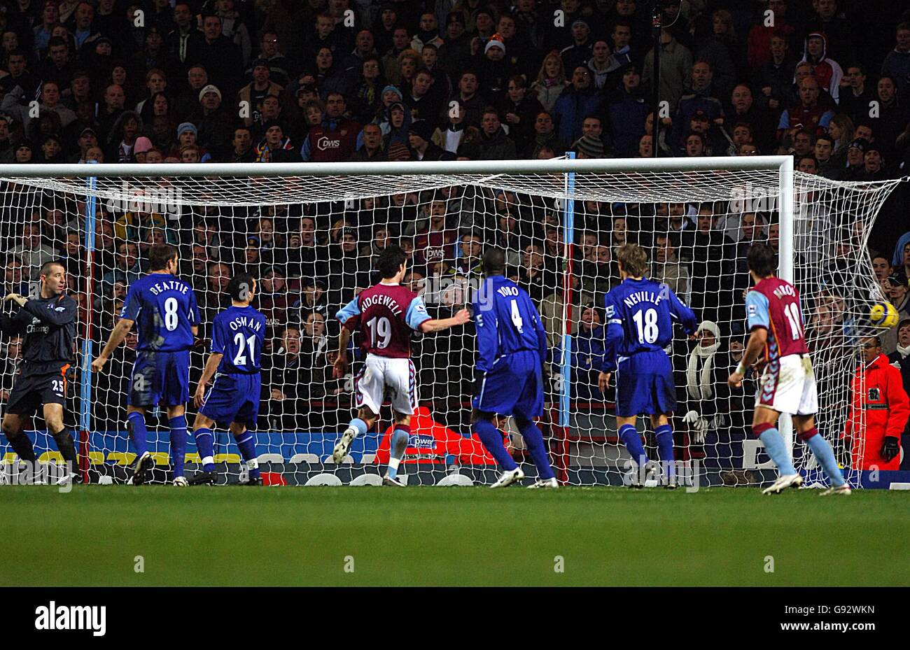 The Everton defence can only look as the ball hits the back of the net ...