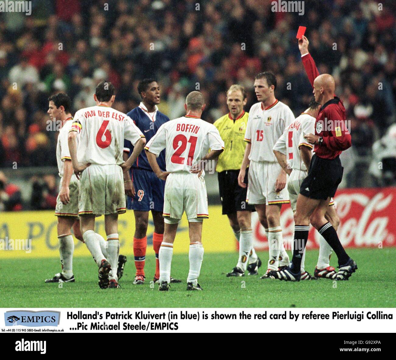 Holland's Patrick Kluivert (in blue) is shown the red card by referee ...