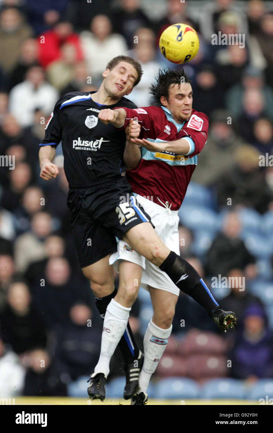 Burnley's Michael Duff (R) is beaten to a high ball by Sheffield ...