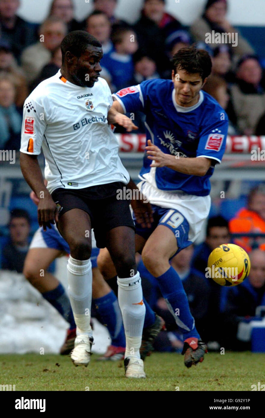 Ipswich Town's Jimmy Juan (R) holds off Luton Town's Enoch Showunmi ...