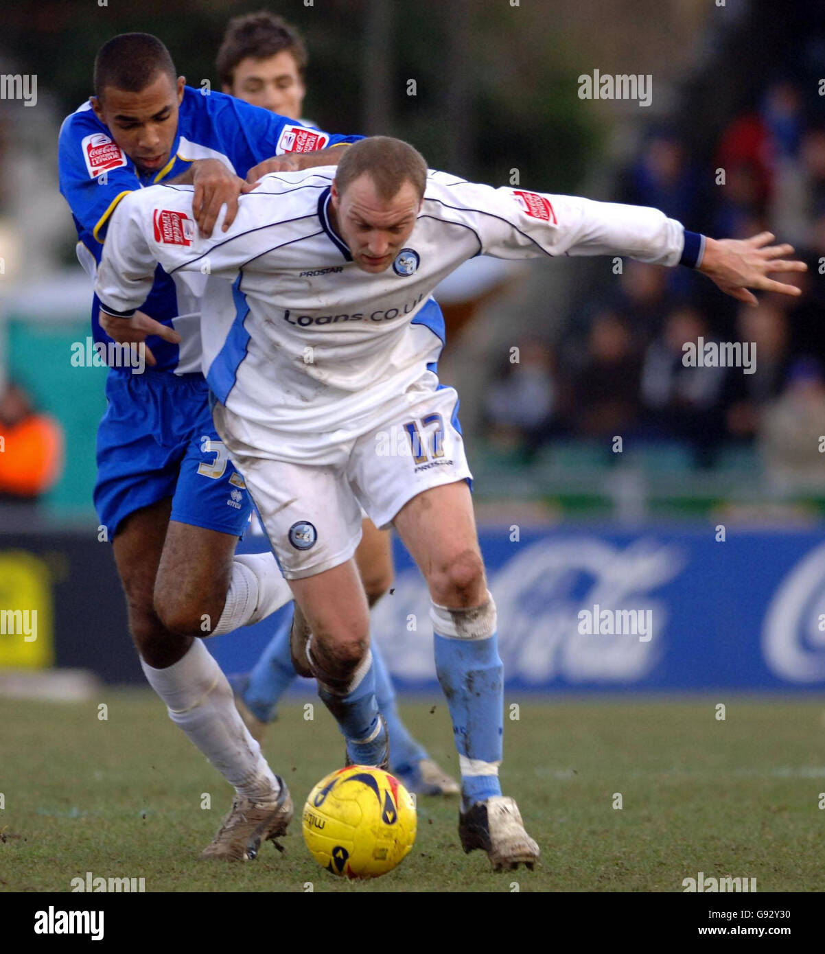 Wycombe Wanderers' Charlie Griffin (R) is shadowed by Bristol Rovers ...