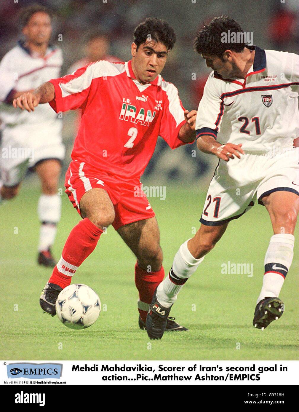 Mehdi Mahdavikia of Iran (left) takes on USA's Claudio Reyna (right ...