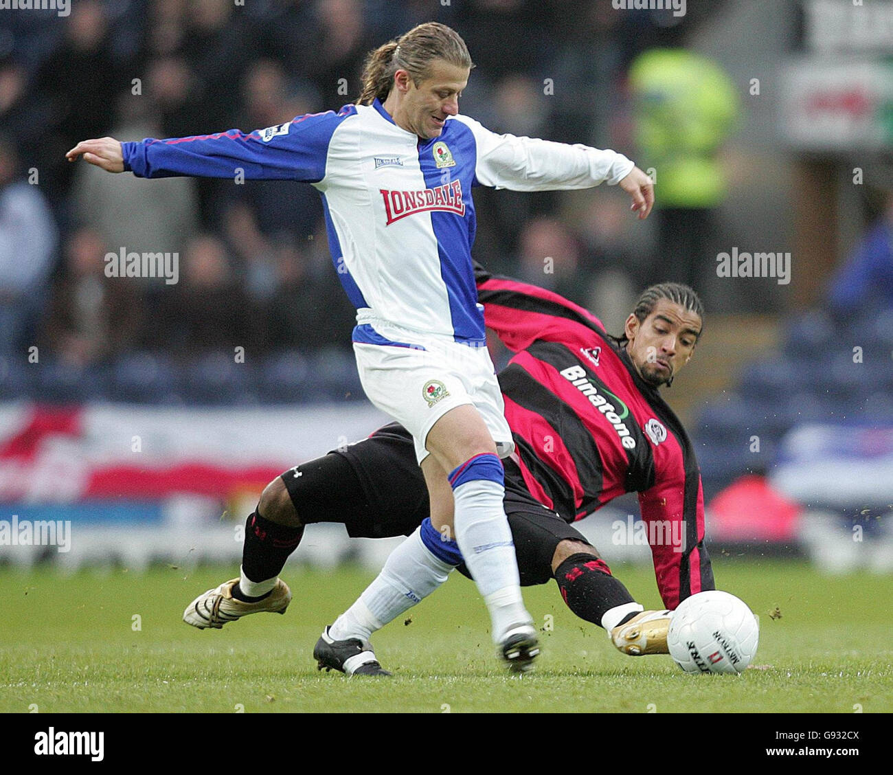 Blackburn's Kerimoglu Tugay (L) battles for the ball QPR's Richard Langley during the FA Cup ...