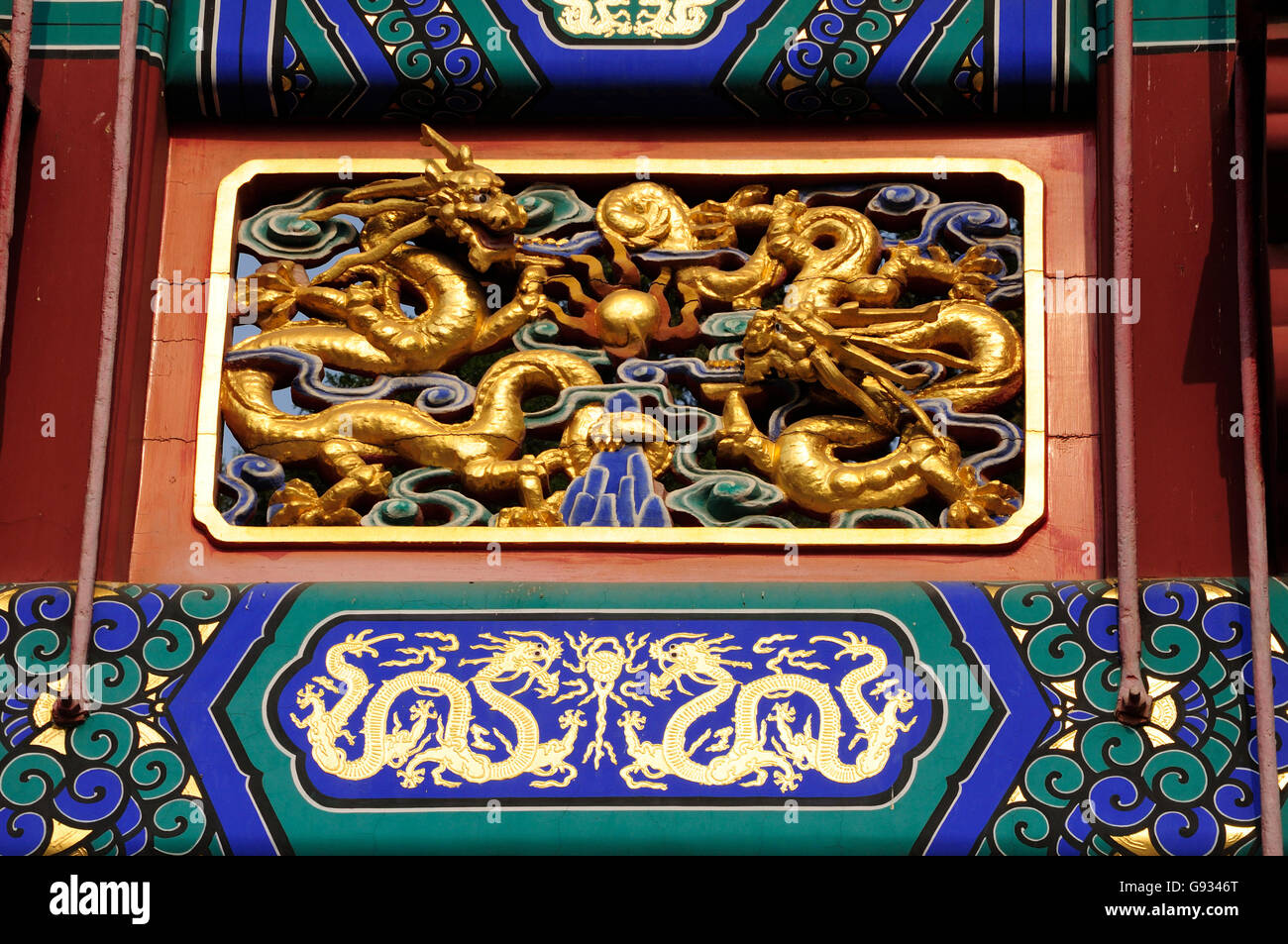 Golden chinese dragon architectural details on a gate within Jingshan ...