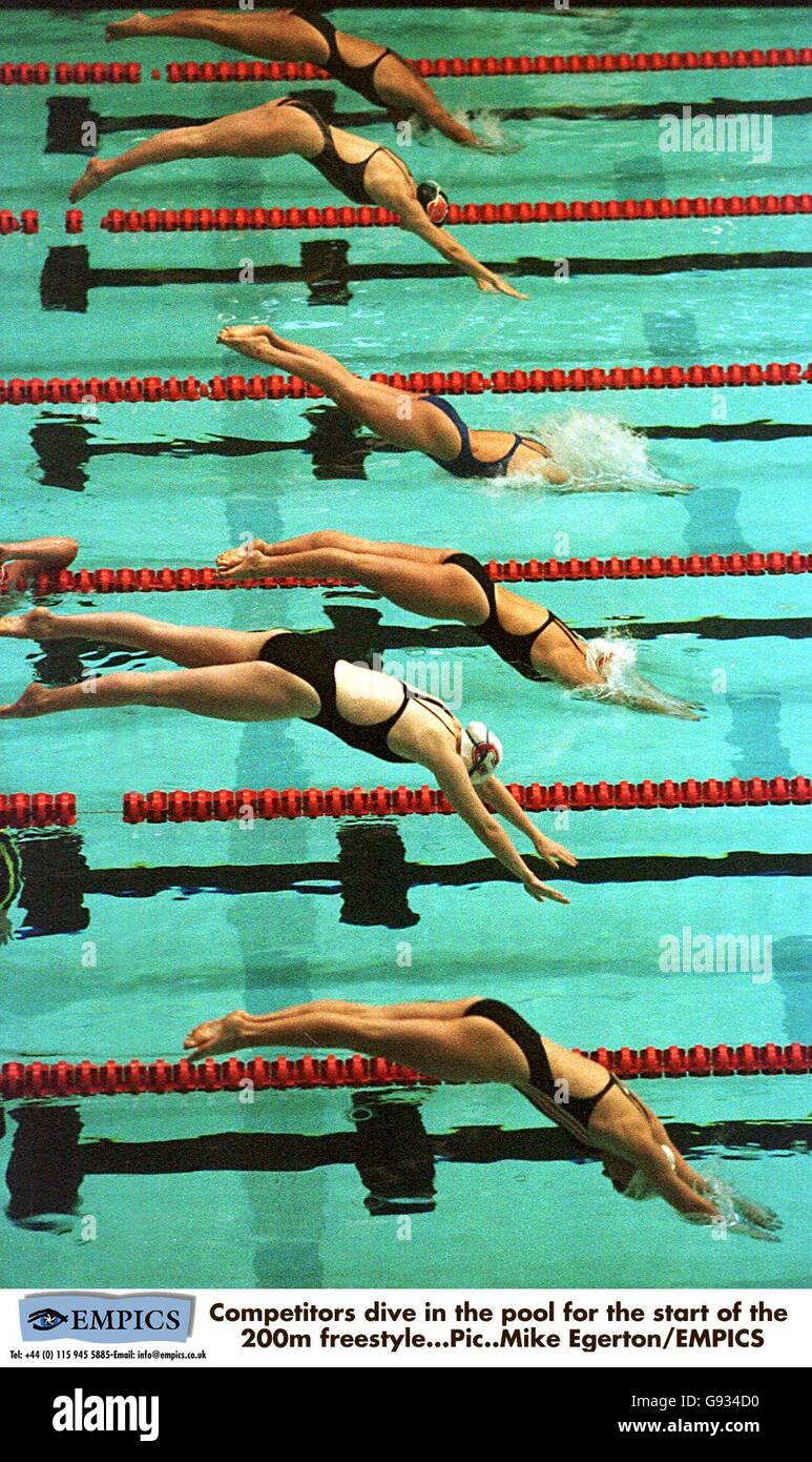 Competitors dive in the pool for the start of the women's 200m ...