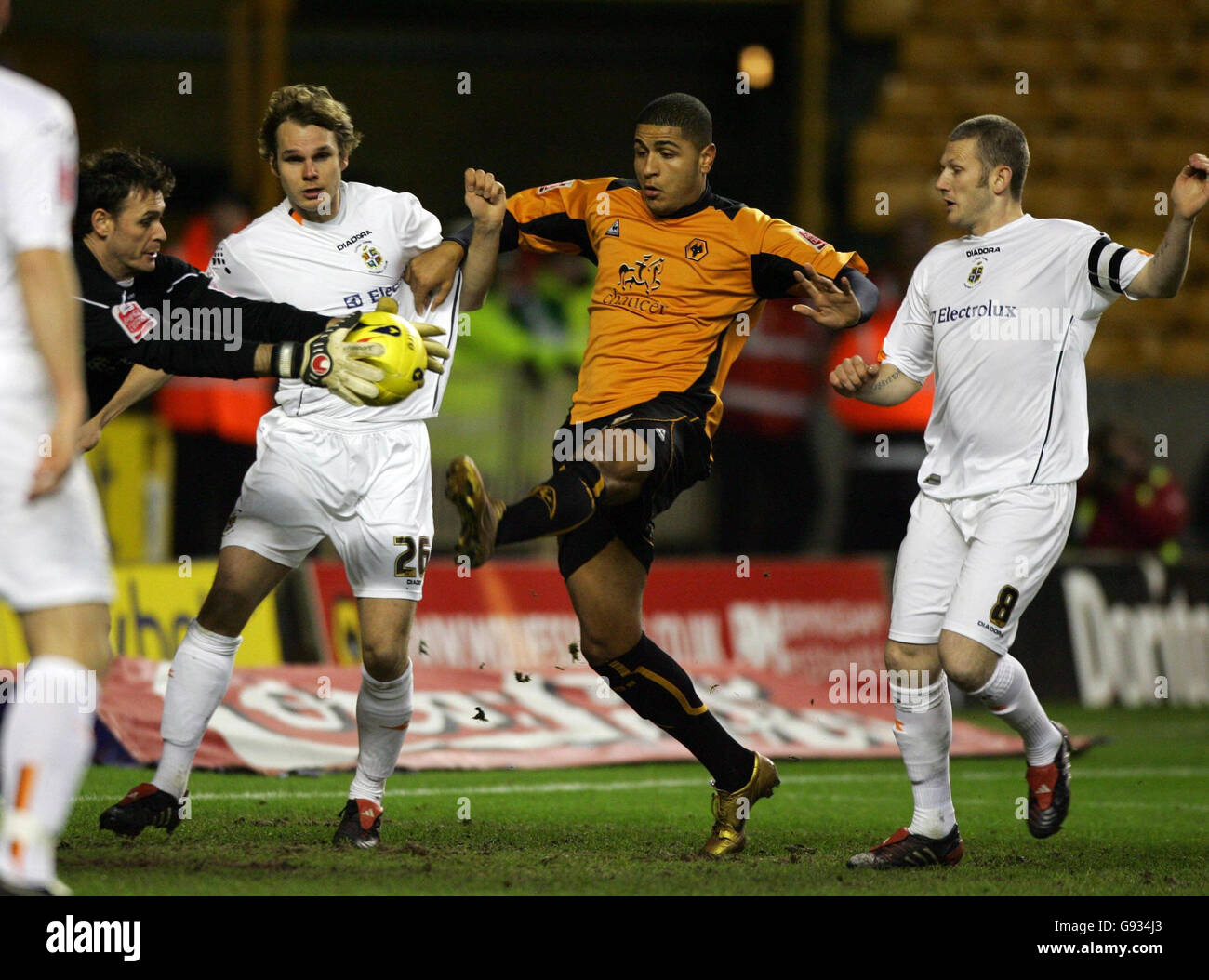 Wolverhampton Wanderers Leon Clarke (C) challenges for the ball as ...