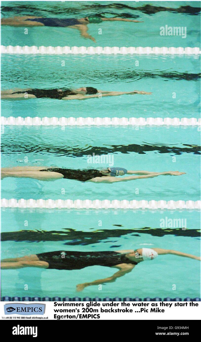 Australia Commonwealth Games Swimming. Swimmers glide under the water ...