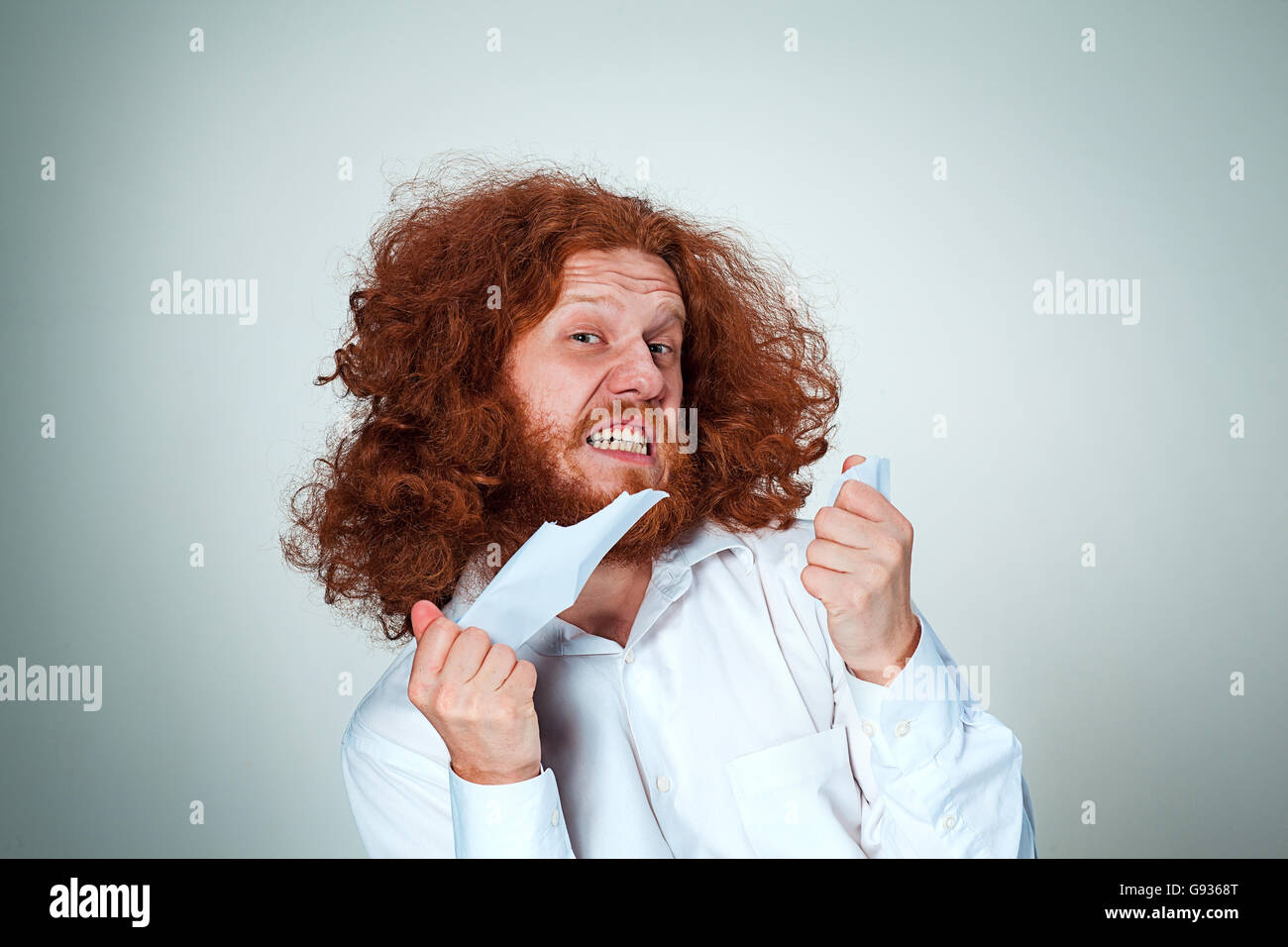 Angry man tear out paper Stock Photo - Alamy
