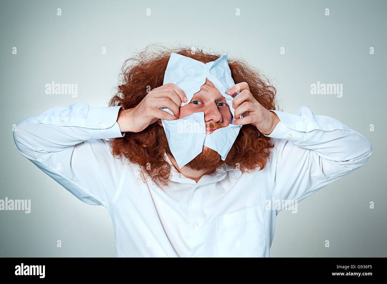 Angry man tear out paper Stock Photo - Alamy