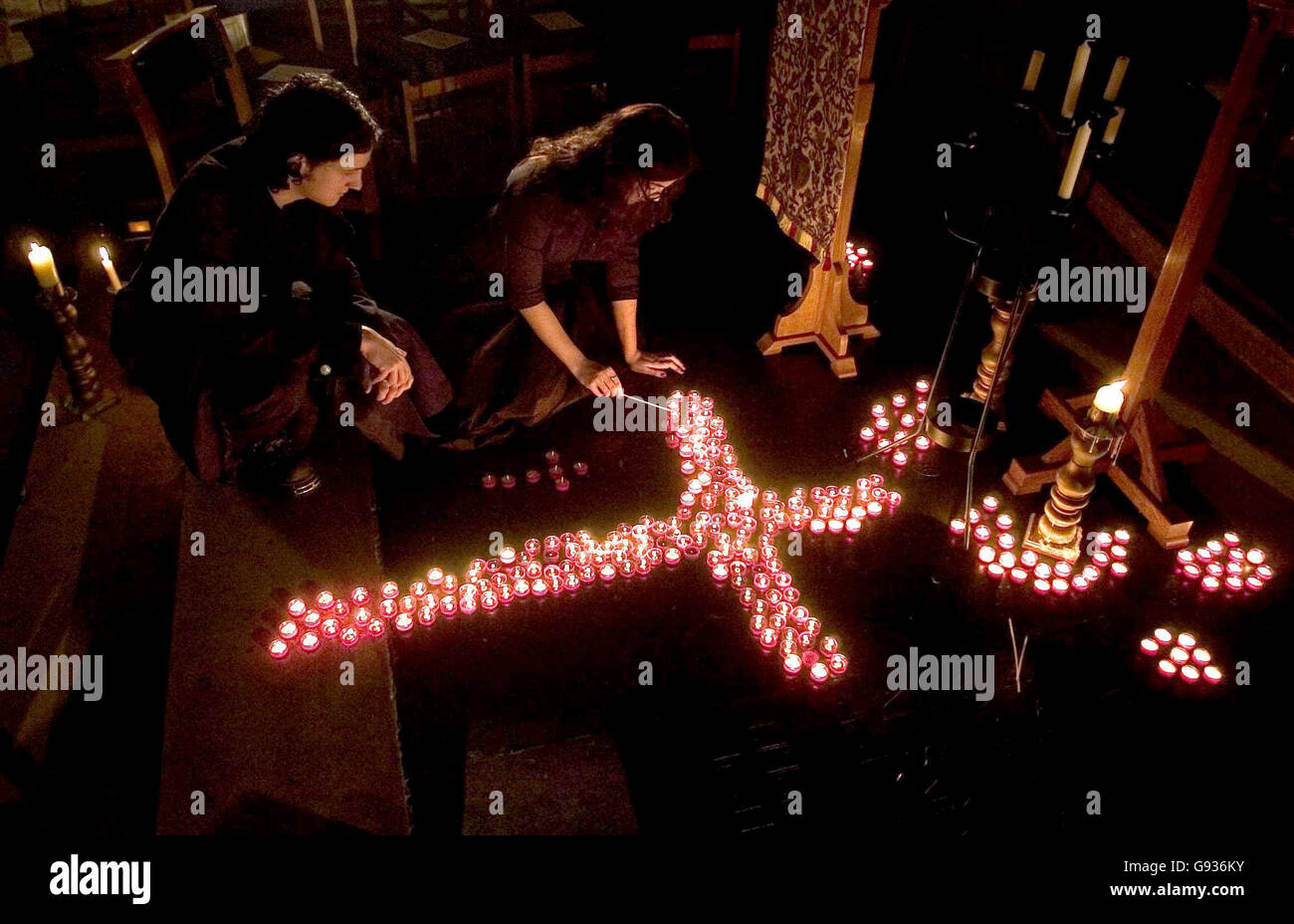 Light candles during a goth eucharist service hi-res stock photography ...