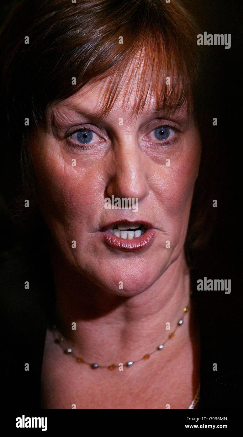 Charlotte Yeates from campaign group Parents For Justice reads a ...