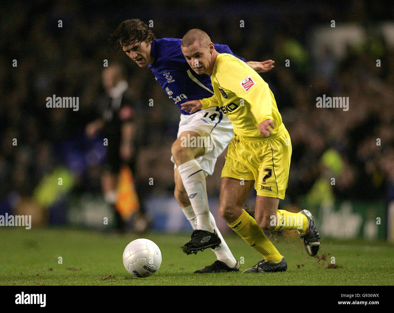 Everton's Kevin Kilbane battles with Millwall's Alan Dunne (R) for the ...