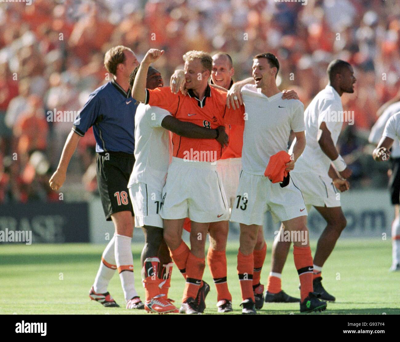 Holland's Dennis Bergkamp (centre) celebrates scoring the winning goal ...