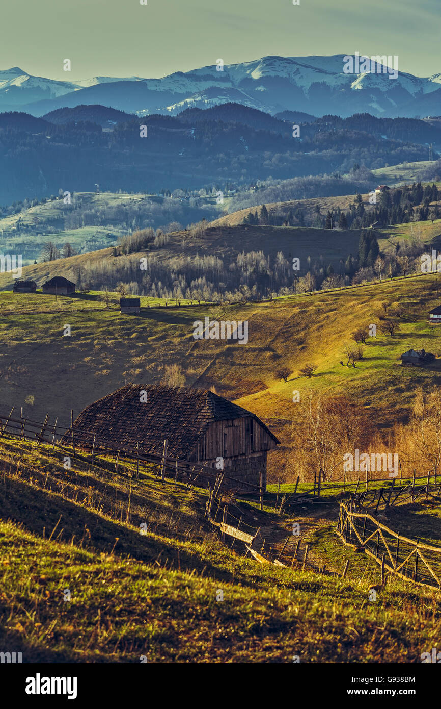 Picturesque rural landscape with traditional wooden house up in the ...