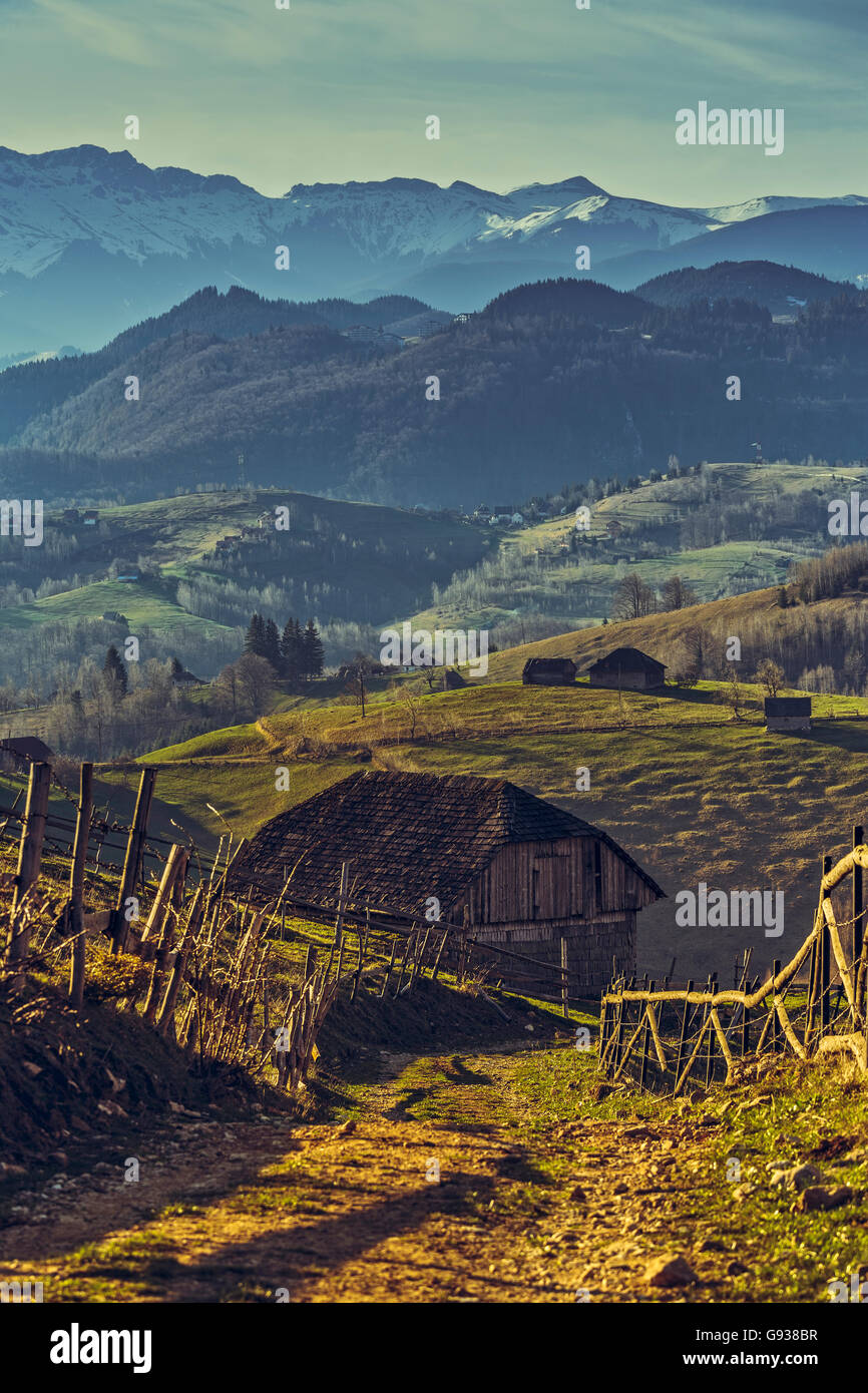 Picturesque spring rural scene with old Romanian wooden shack and ...