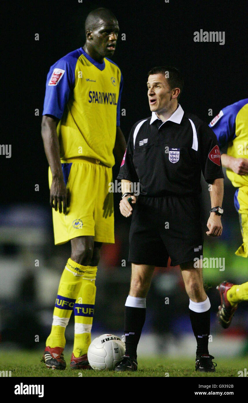 Torquay United's Morike Sako at 6ft 7in towers over referee Keith ...
