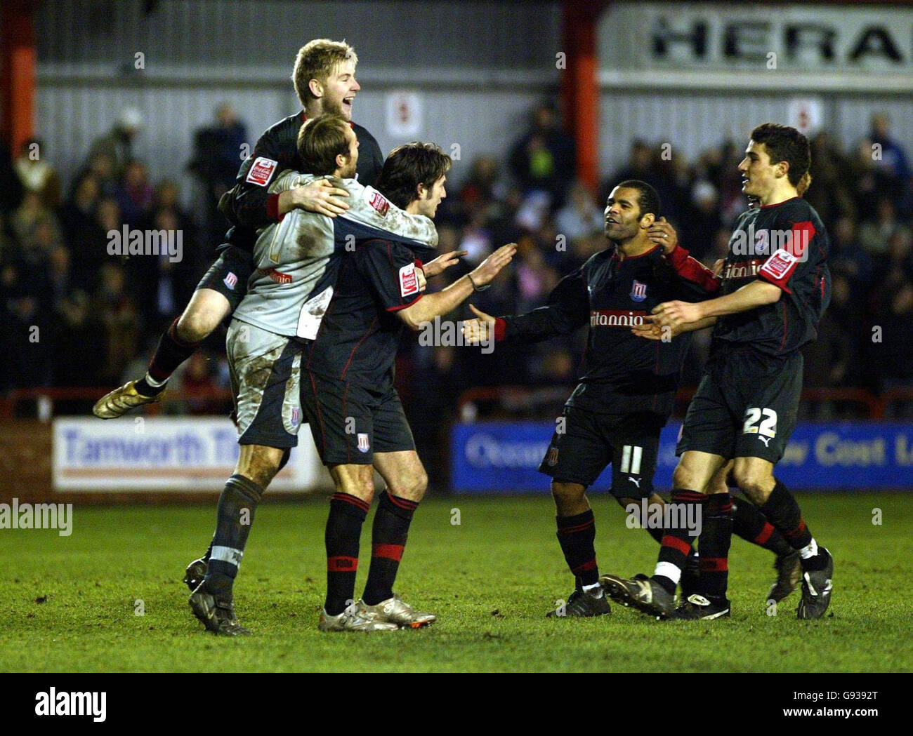 Stoke players rush to congratulate goalkeeper Steve Simonsen after ...