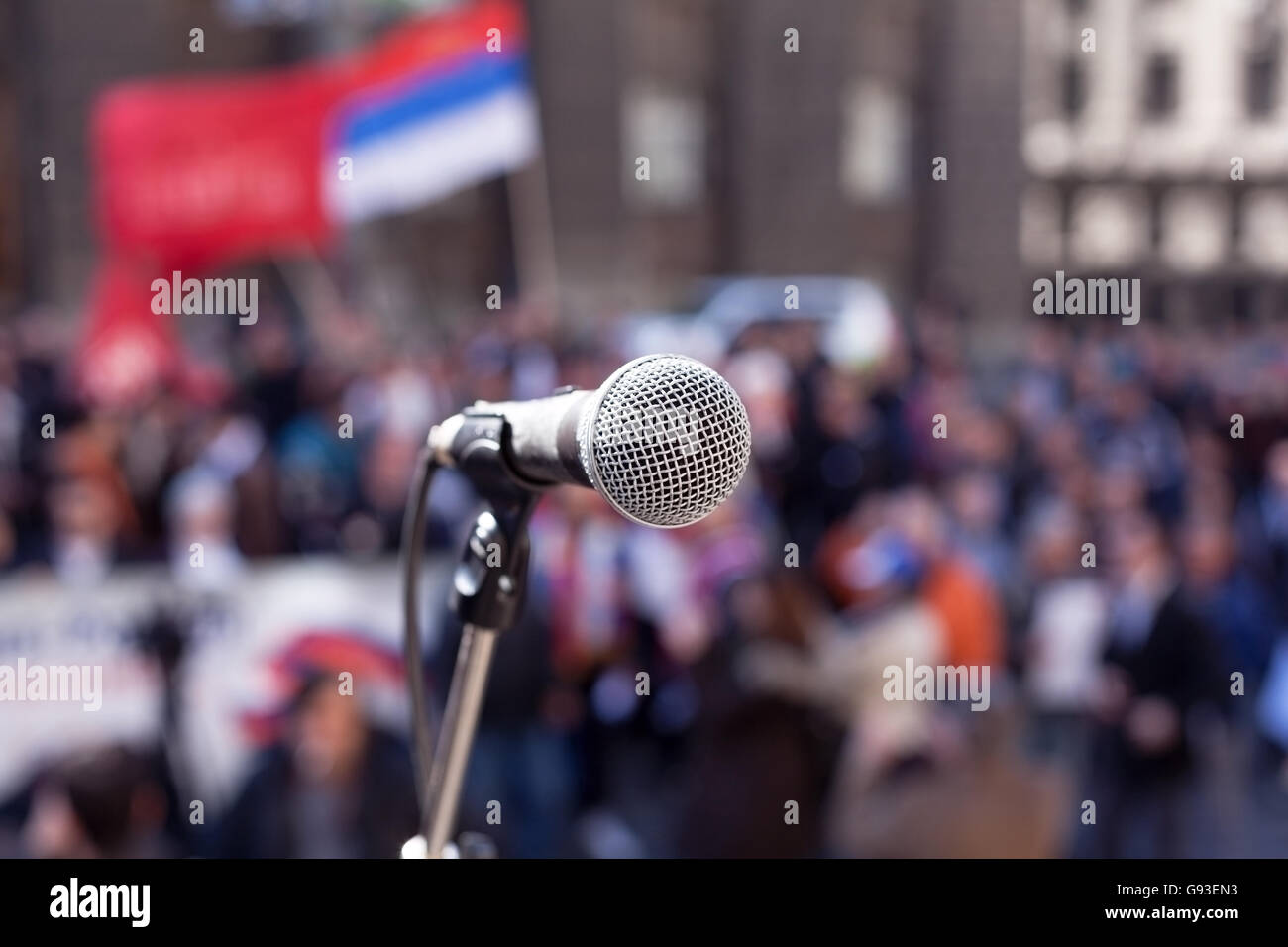 Microphone in focus against blurred crowd Stock Photo - Alamy