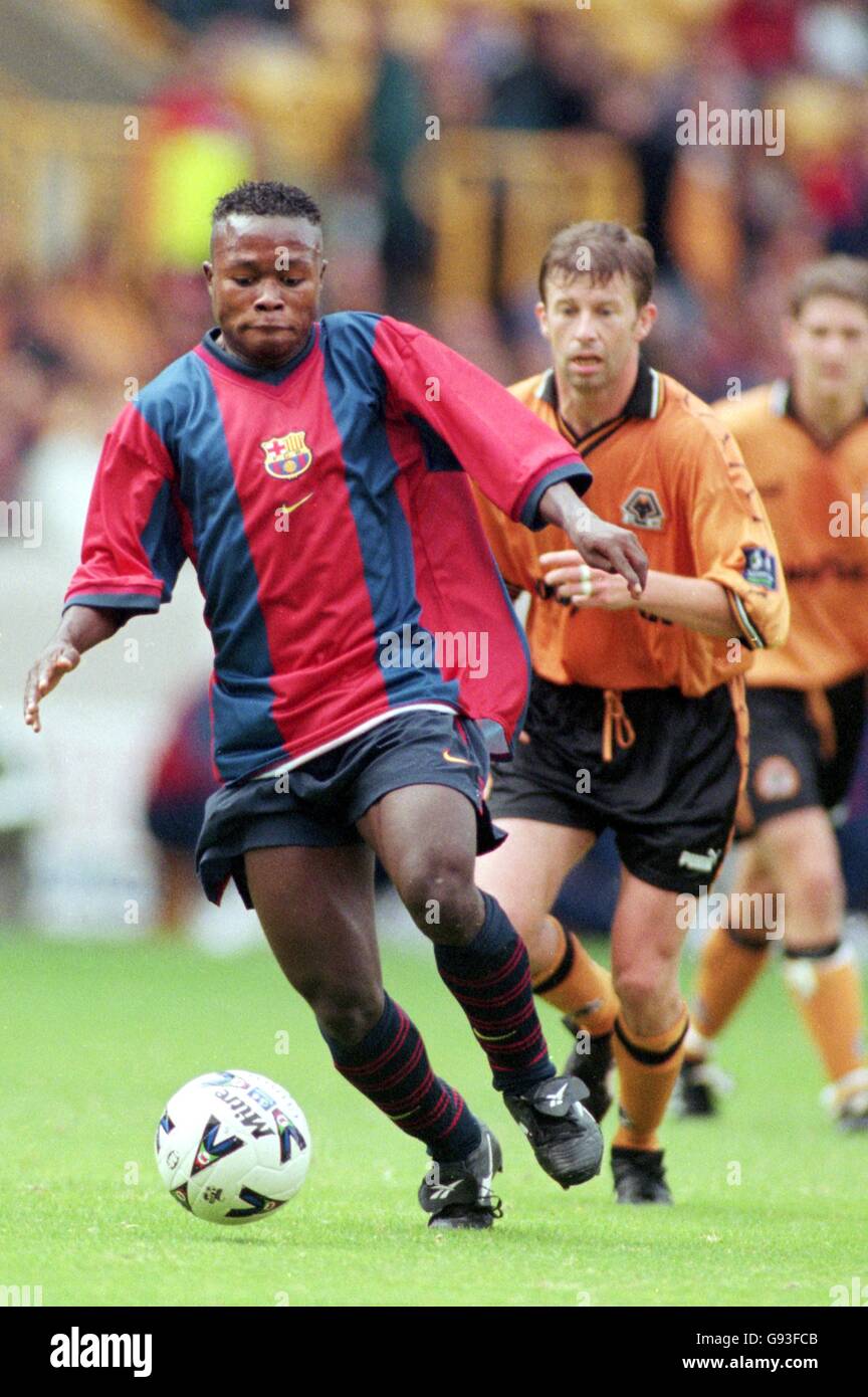 Barcelona's Haruna Babangida (left) gets away from Steve Froggatt of ...