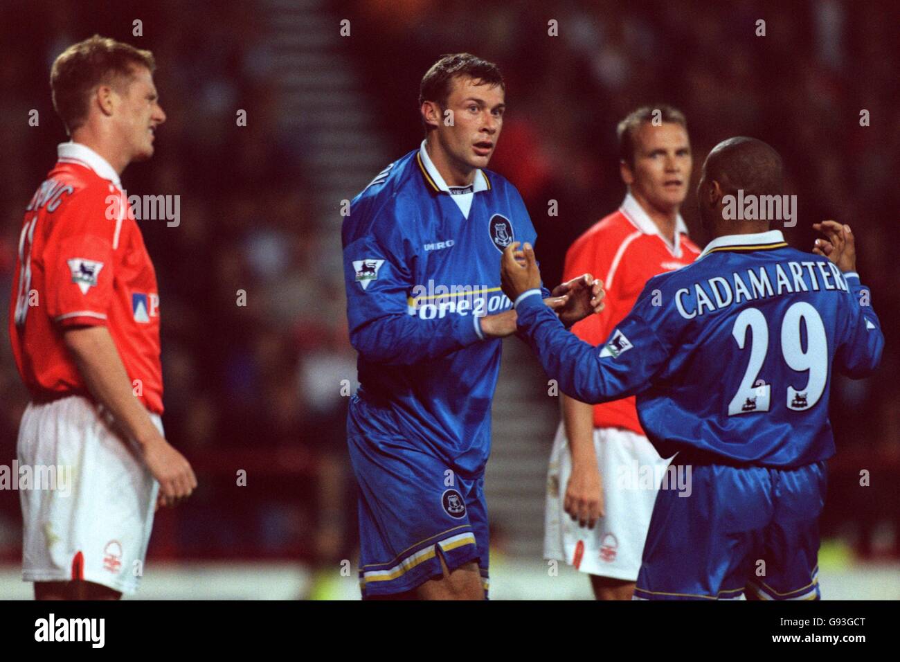 Forest's Geoff Thomas (second right) looks on as Everton's Duncan ...
