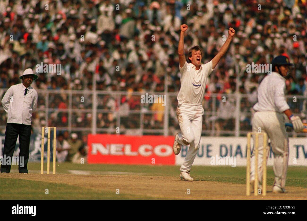 South Africa's Craig Matthews (c) celebrates taking the wicket of India ...