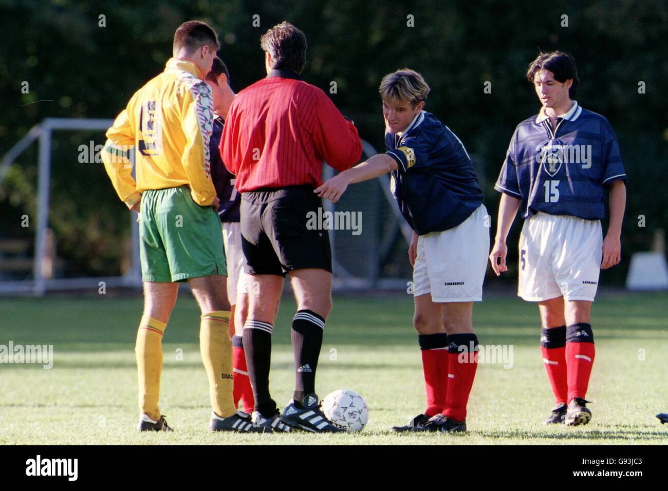 Scotland captain Grant Brebner (second right) complains about the ...