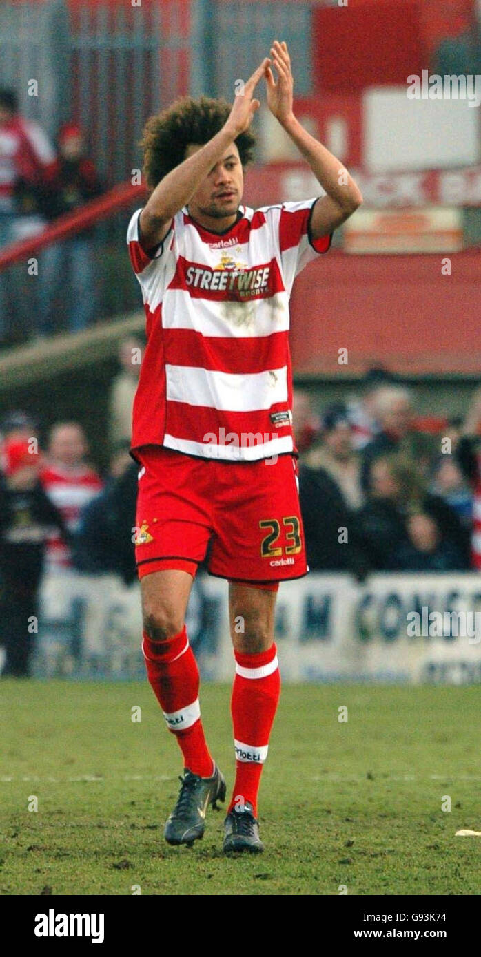 Doncaster's double goal scorer Jason Price applauds the home fans ...