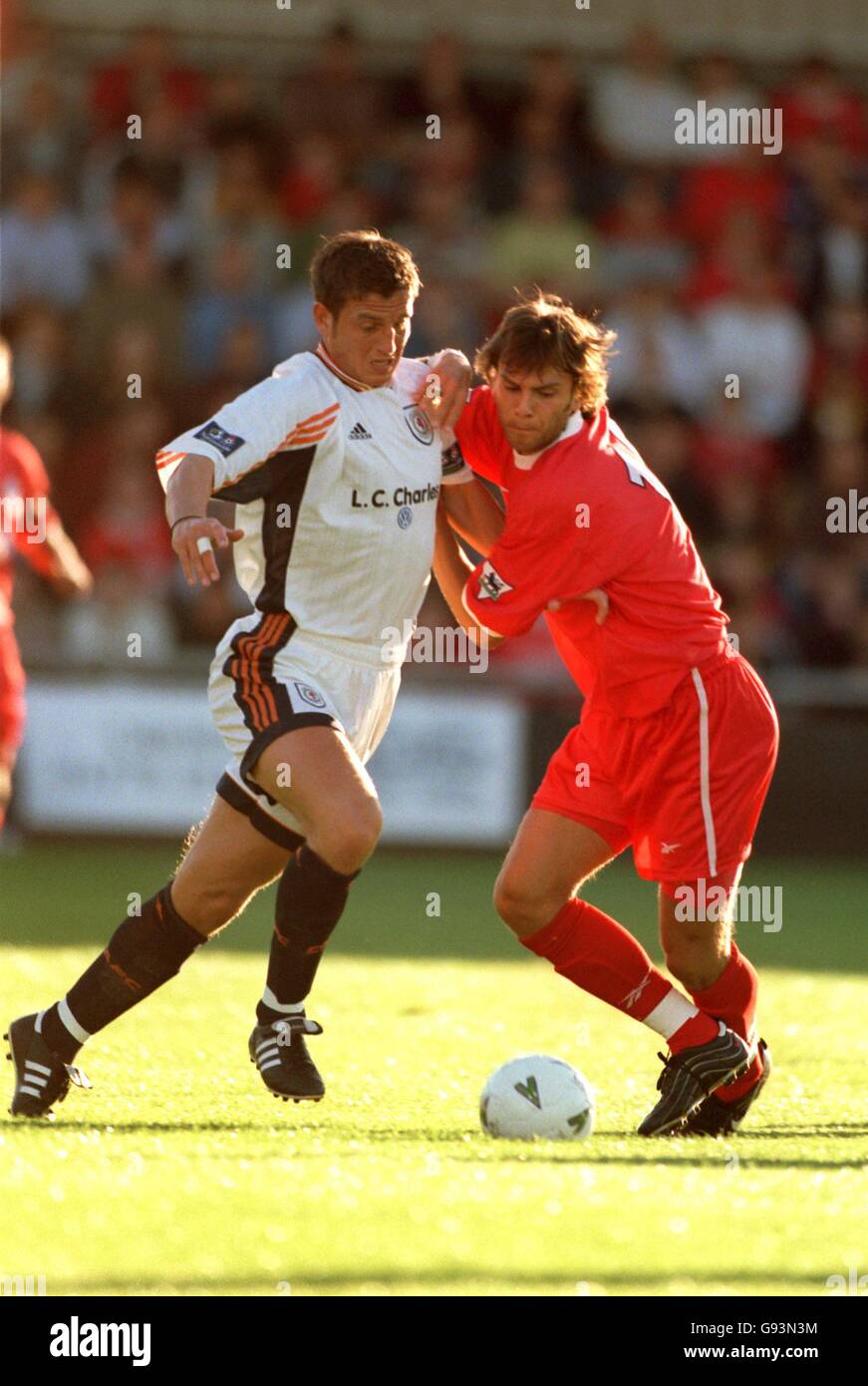 Crewe Alexandra's Dave Walton (left) takes on Liverpool's Patrik Berger ...