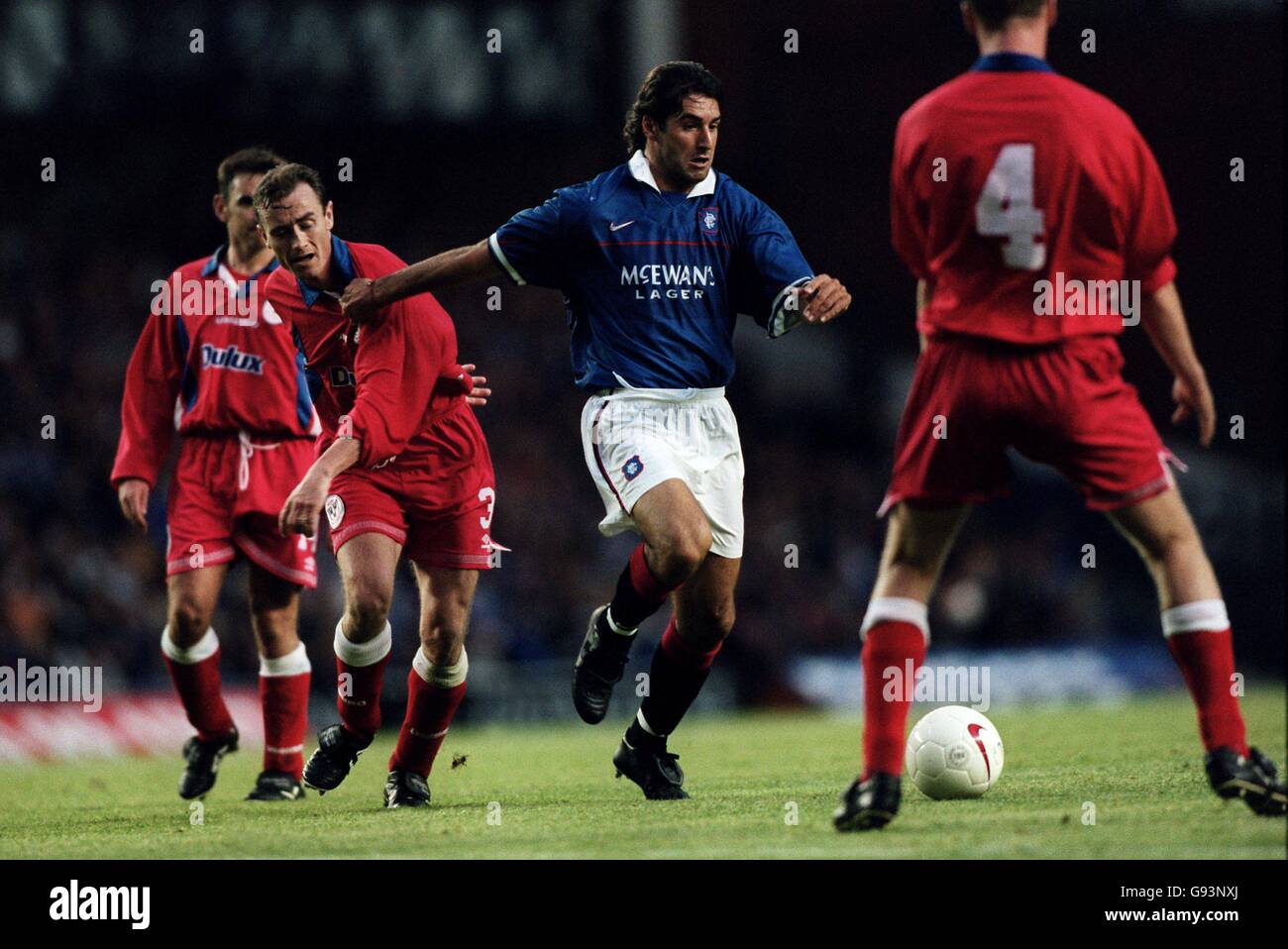 Gabriel Amato of Rangers (centre) holds Declan Geoghegan of Shelbourne ...