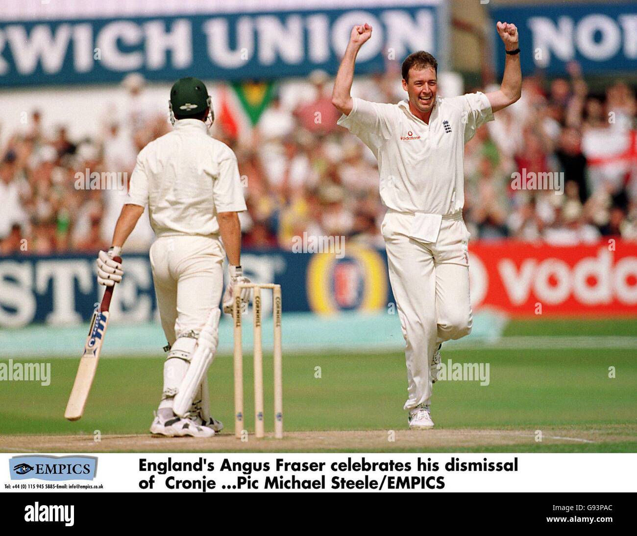 England's Angus Fraser (right) celebrates his dismissal of South Africa ...