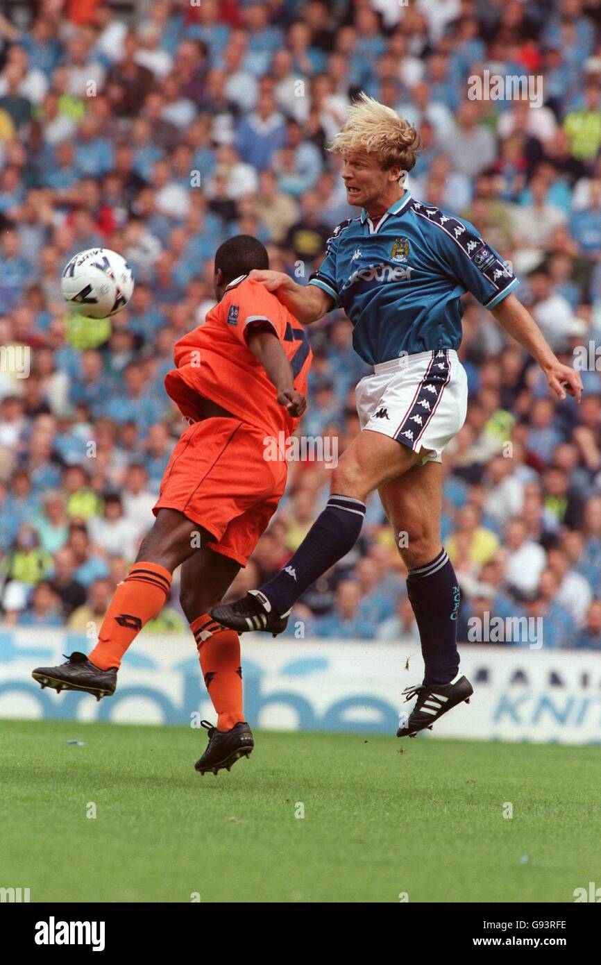 Blackpool's Marvin Bryan (left) and Manchester City's Gerard Wiekens ...