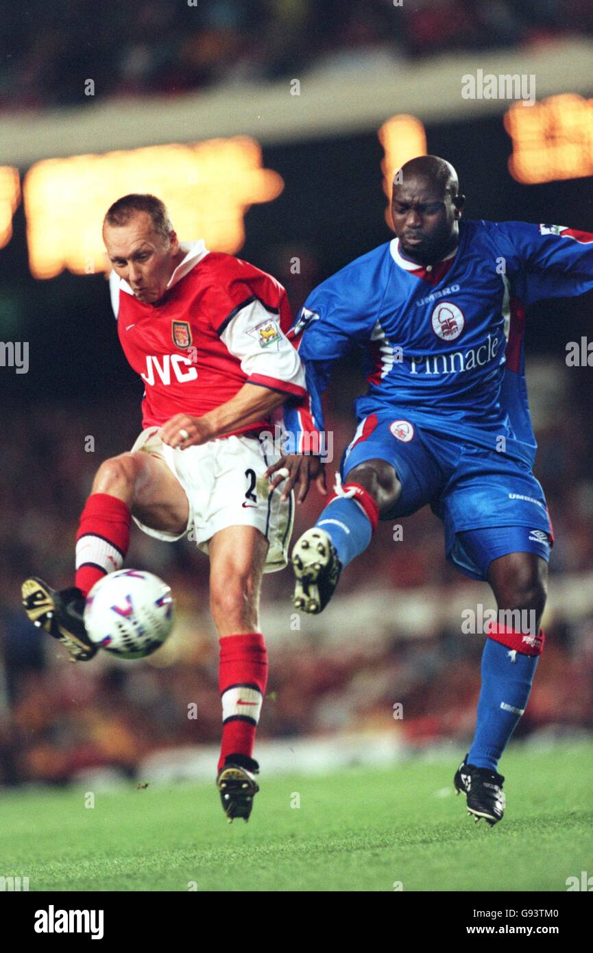 Arsenal's Lee Dixon (left) clears from Nottingham Forest's Jean-Claude ...