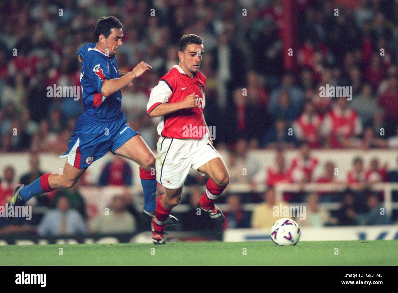 Arsenal's Marc Overmars (right) outpaces Nottingham Forest's Steve ...